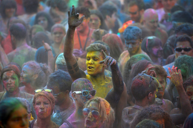 Revellers take part in the Monsoon Holi Madrid festival in Madrid ...