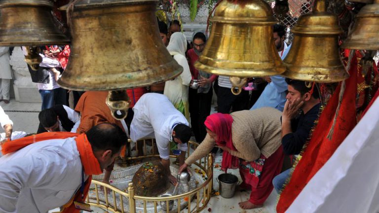 Devotees offer milk in temple during Maha Shivratri festival, in Jammu ...